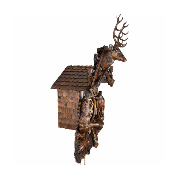 Carved 8-day hunting style musical cuckoo clock with stag head, rifles ...