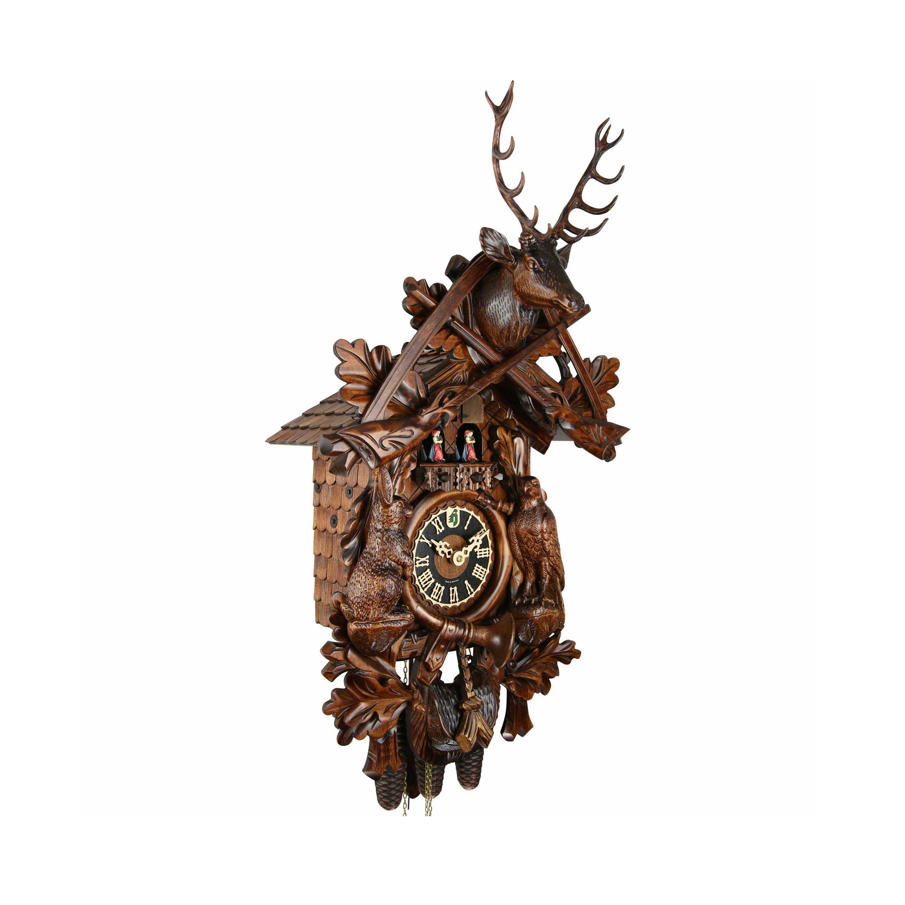Carved 8-day hunting style musical cuckoo clock with stag head, rifles ...