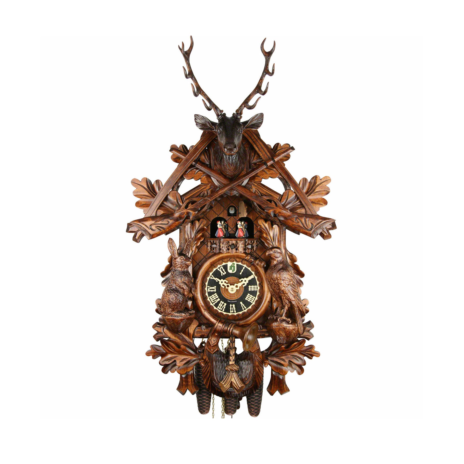 Carved 8-day hunting style musical cuckoo clock with stag head, rifles ...