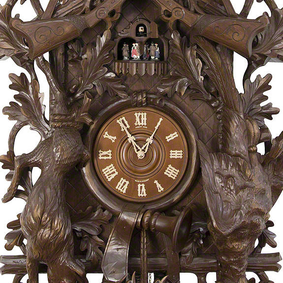 Carved hunting-style 8-day musical cuckoo clock with mounted stag head ...